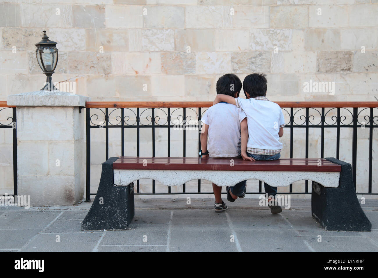Two close friends sitting on the bench Stock Photo - Alamy