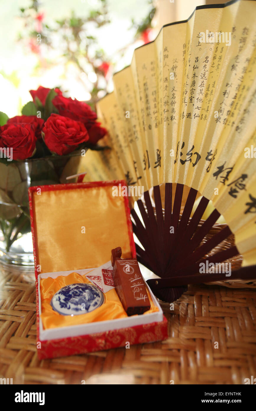 Chinese signet with ink-pot, fun and flowers Stock Photo - Alamy