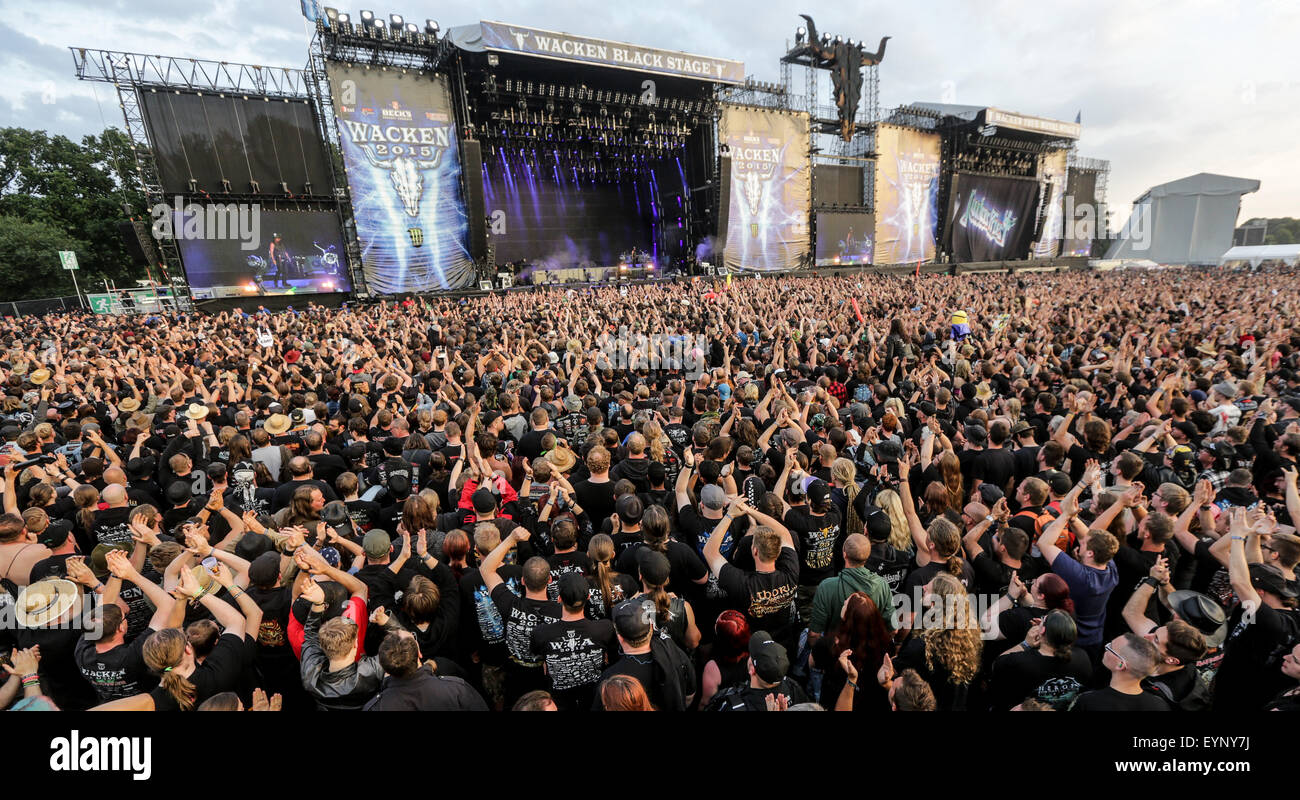 Wacken, Germany. 01st Aug, 2015. Visitors celebrate in front of the ...