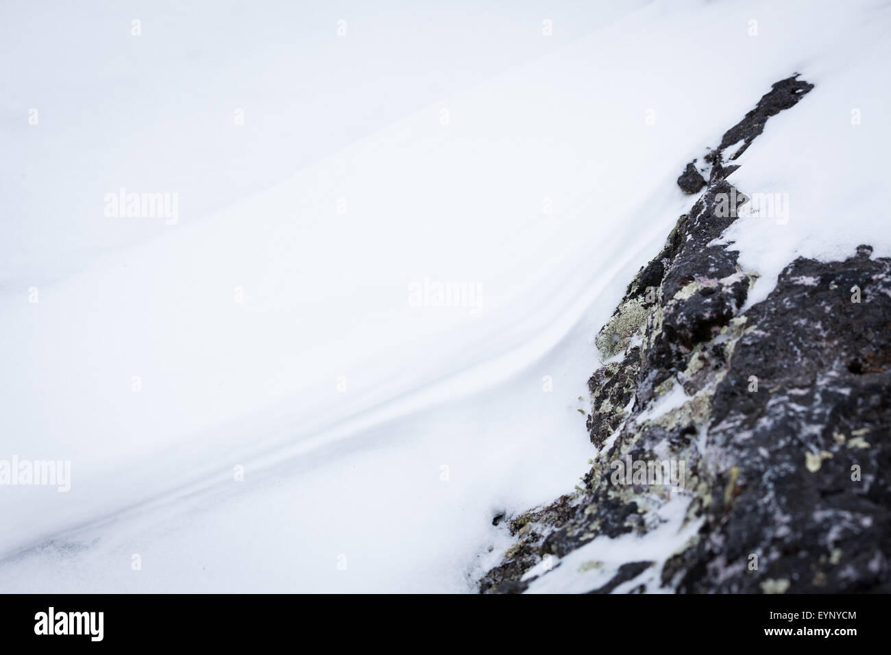 White snow and rock background Stock Photo - Alamy