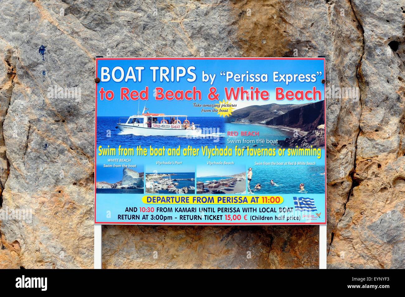 A sign advertising boat trips to red and white beach from Perissa ...
