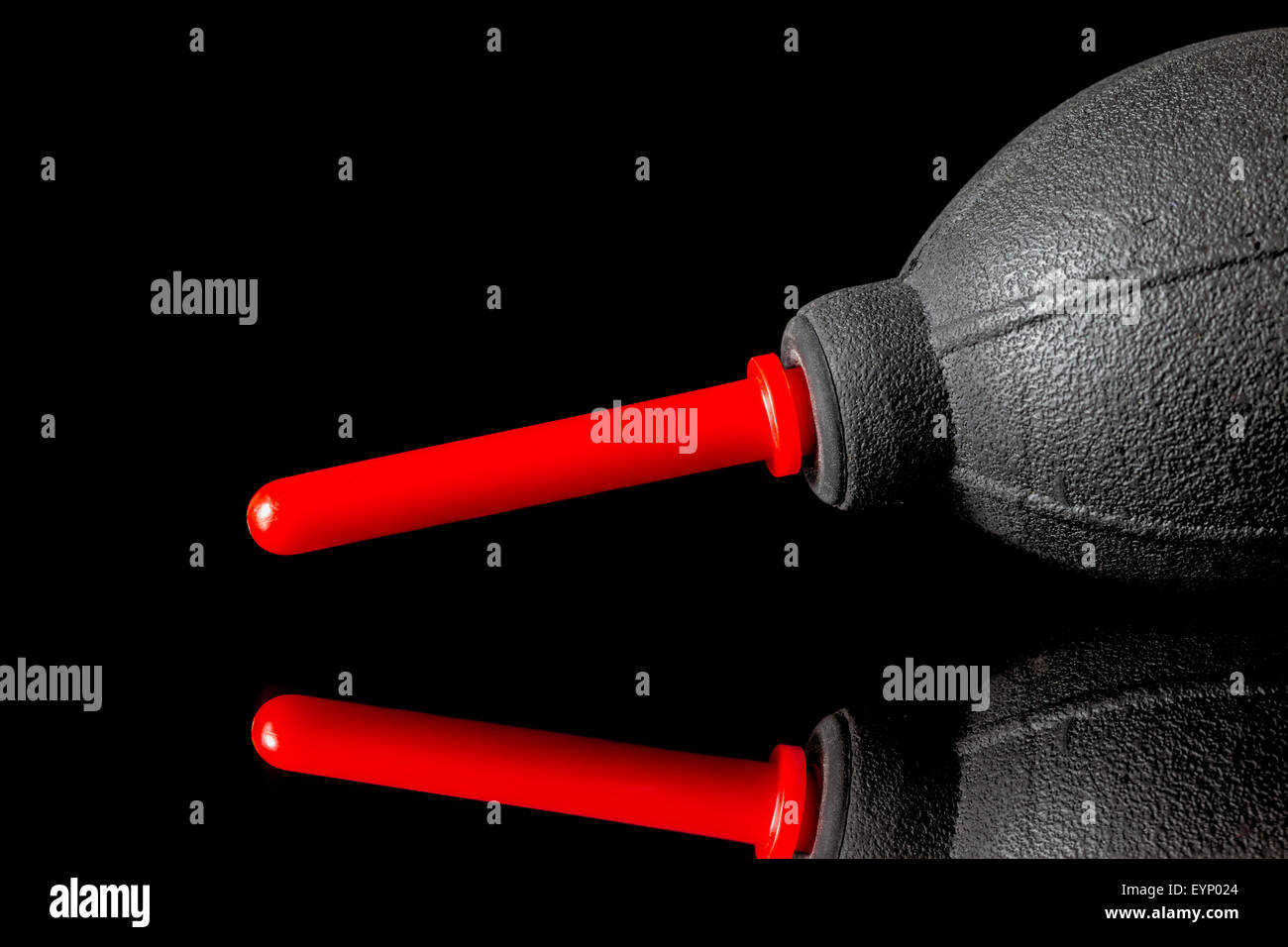 This lens blowpipe in close-up with reflection on a polished tile Stock ...