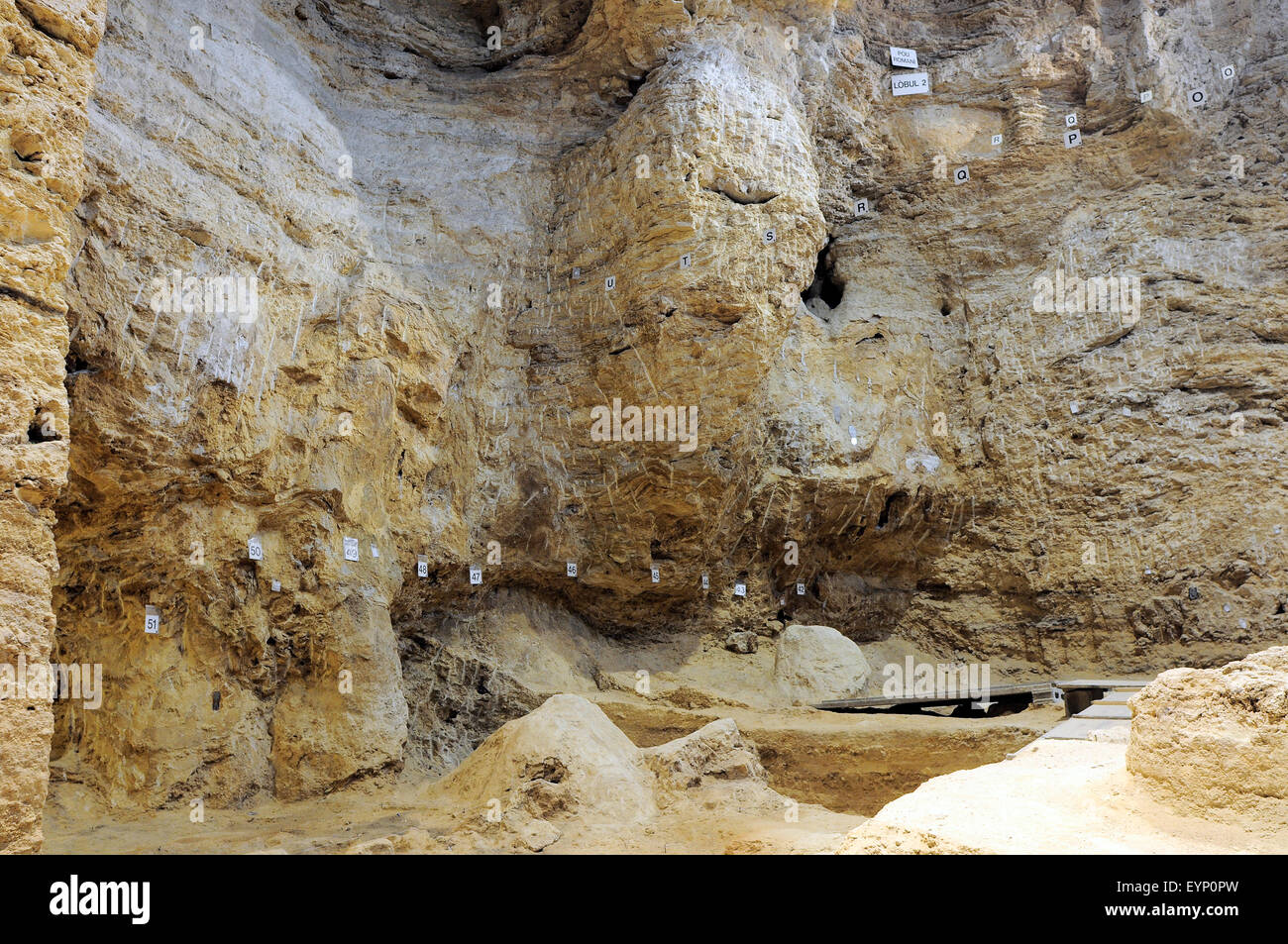 The Abric Romaní, a shelter opened in the travertine Capelló Cliff, is ...