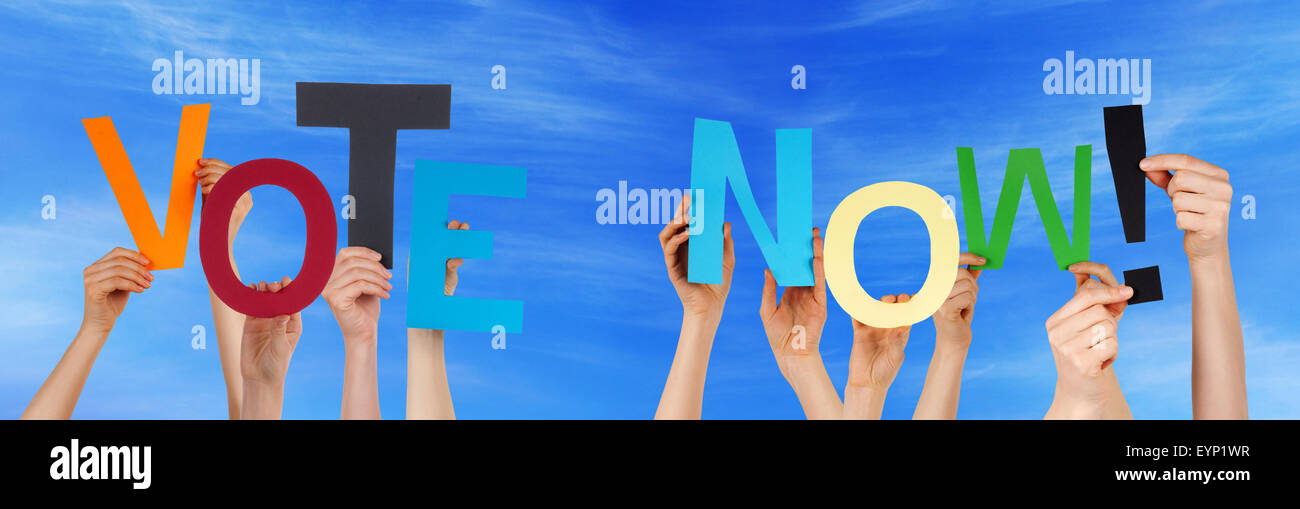 People Hands Holding Colorful Word Vote Now Blue Sky Stock Photo - Alamy