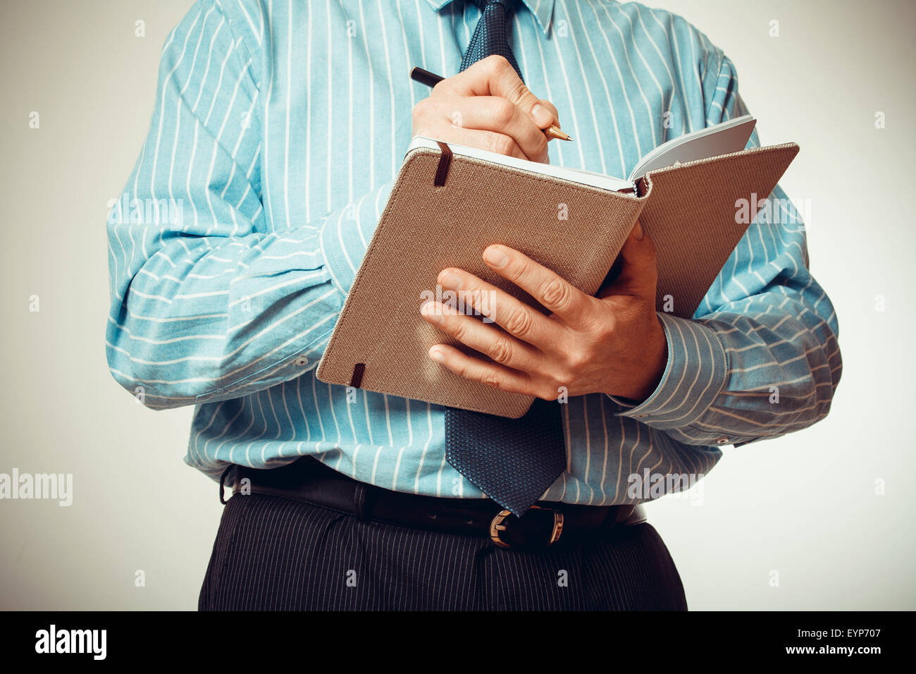 Businessman pen notepad hi-res stock photography and images - Alamy