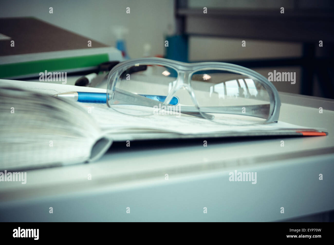 Thick Laboratory Journal with goggles, close up, soft focus Stock Photo ...