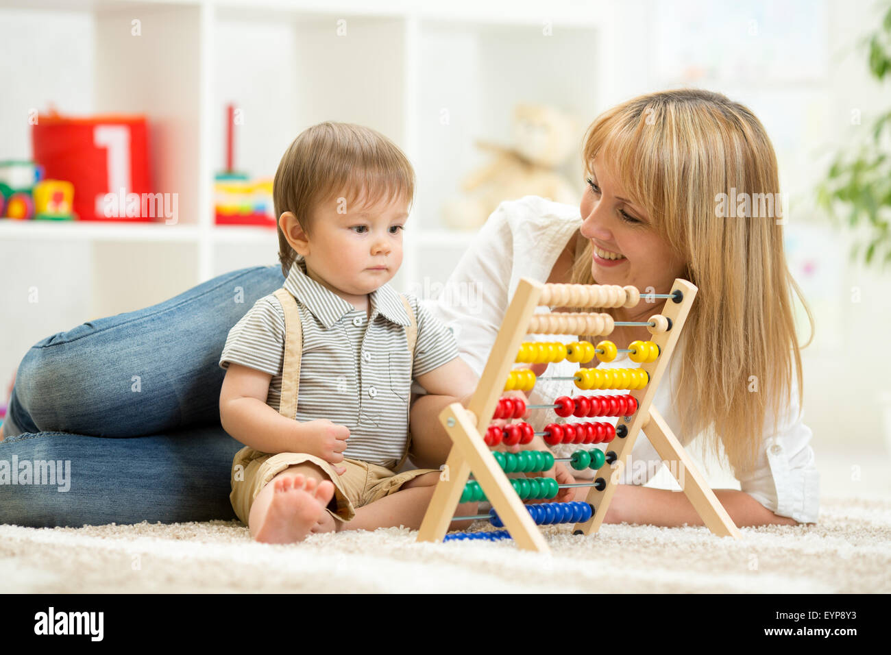 kid toddler playing with abacus Stock Photo - Alamy