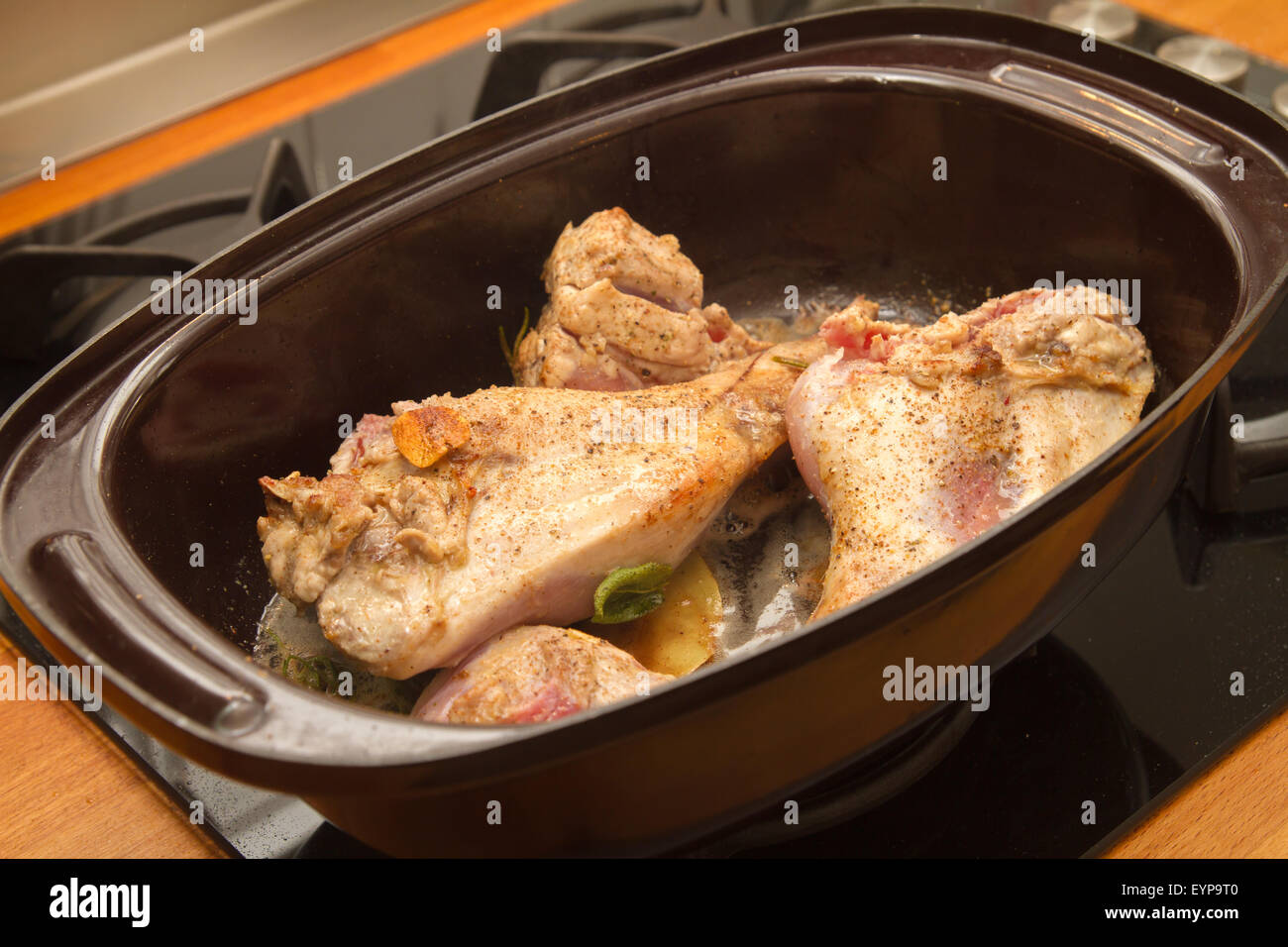 Roast rabbit in the casserole Stock Photo - Alamy