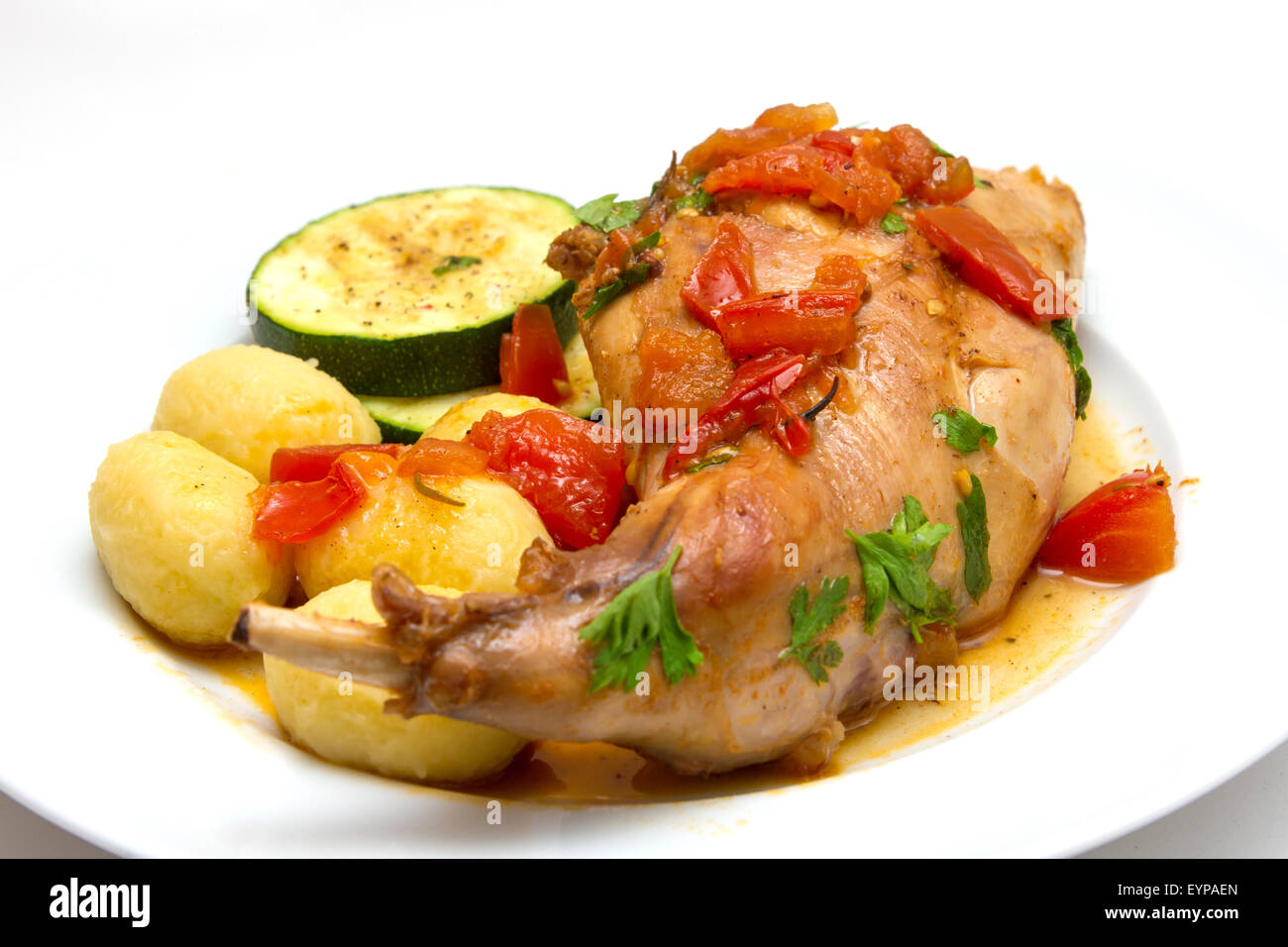 Roast rabbit with gnocchi and zucchini Stock Photo - Alamy