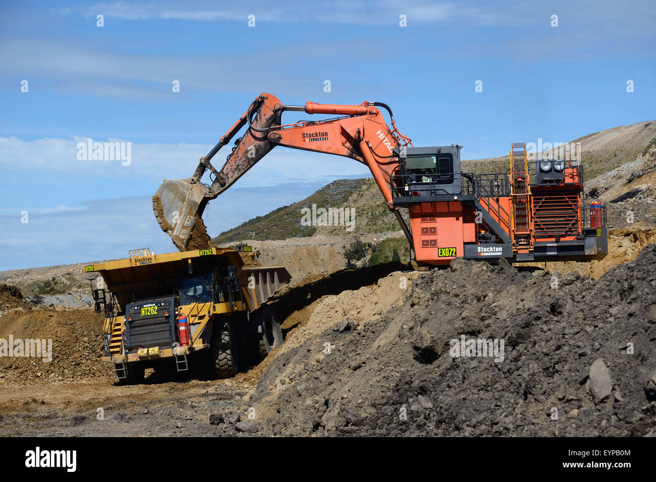 WESTPORT, NEW ZEALAND, MARCH 11, 2015: 190 ton digger loads rock from a ...