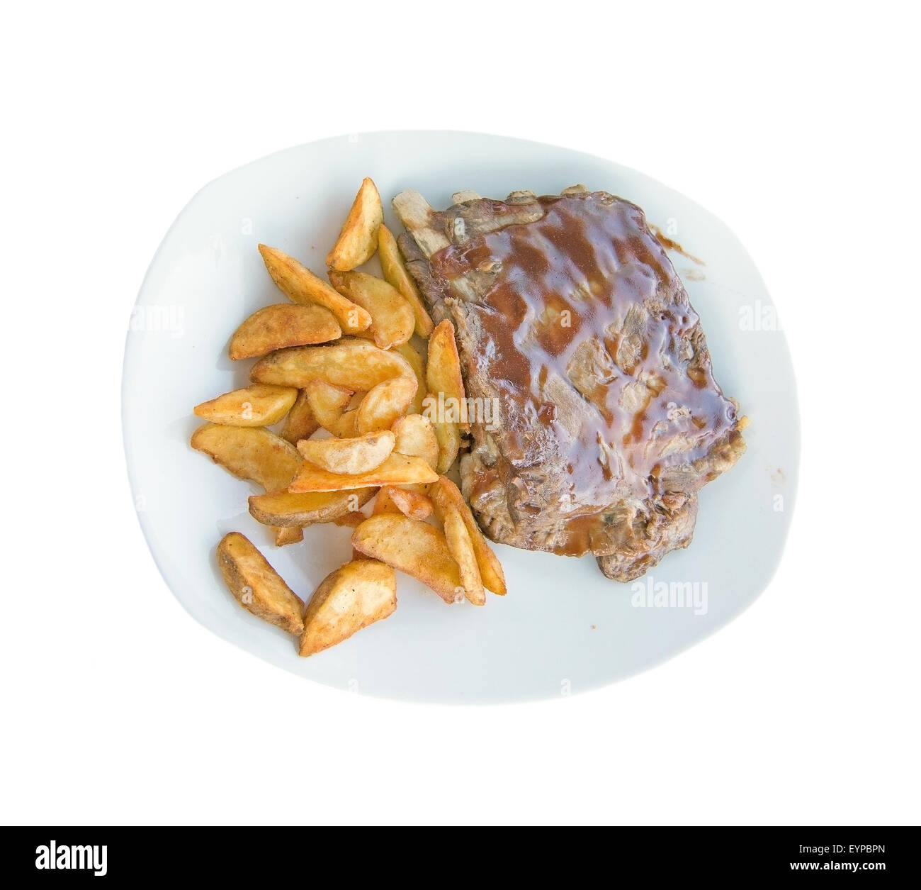 Ribs and fries. Barbecue food on white plate in Mallorca, Balearic ...