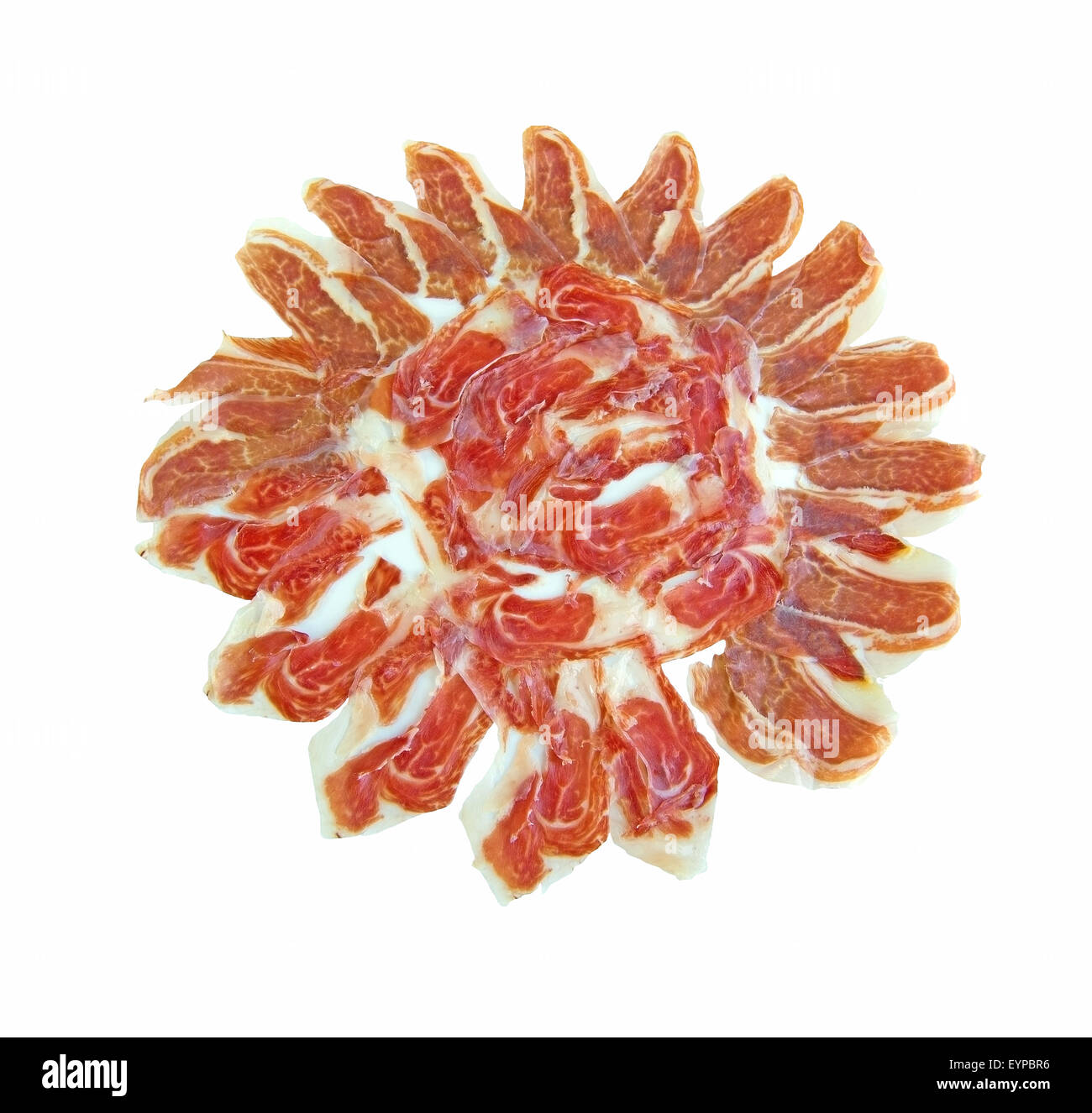 Serrano ham plate in a circle. Food on white plate in Mallorca ...