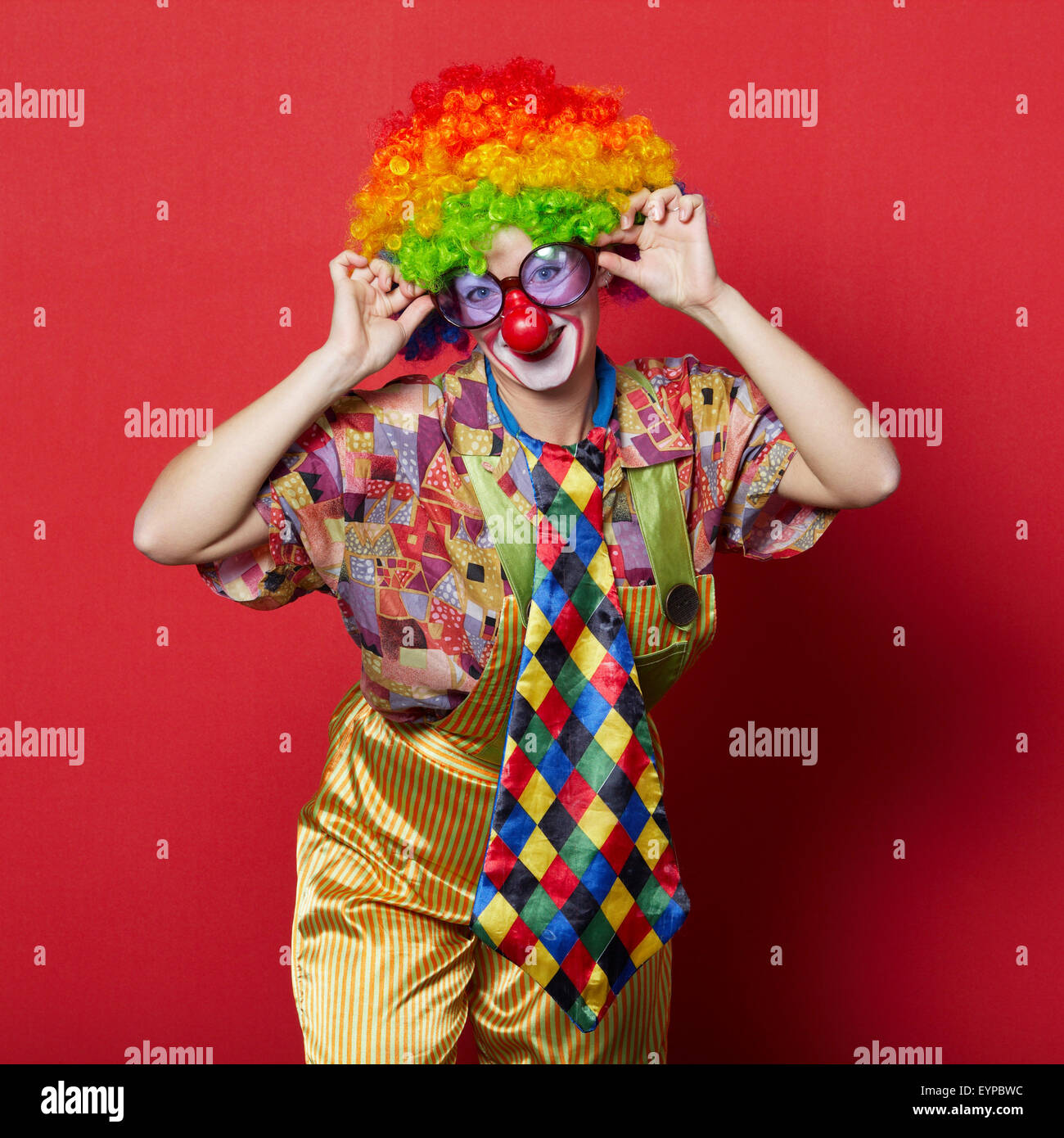 funny clown with glasses on red Stock Photo - Alamy