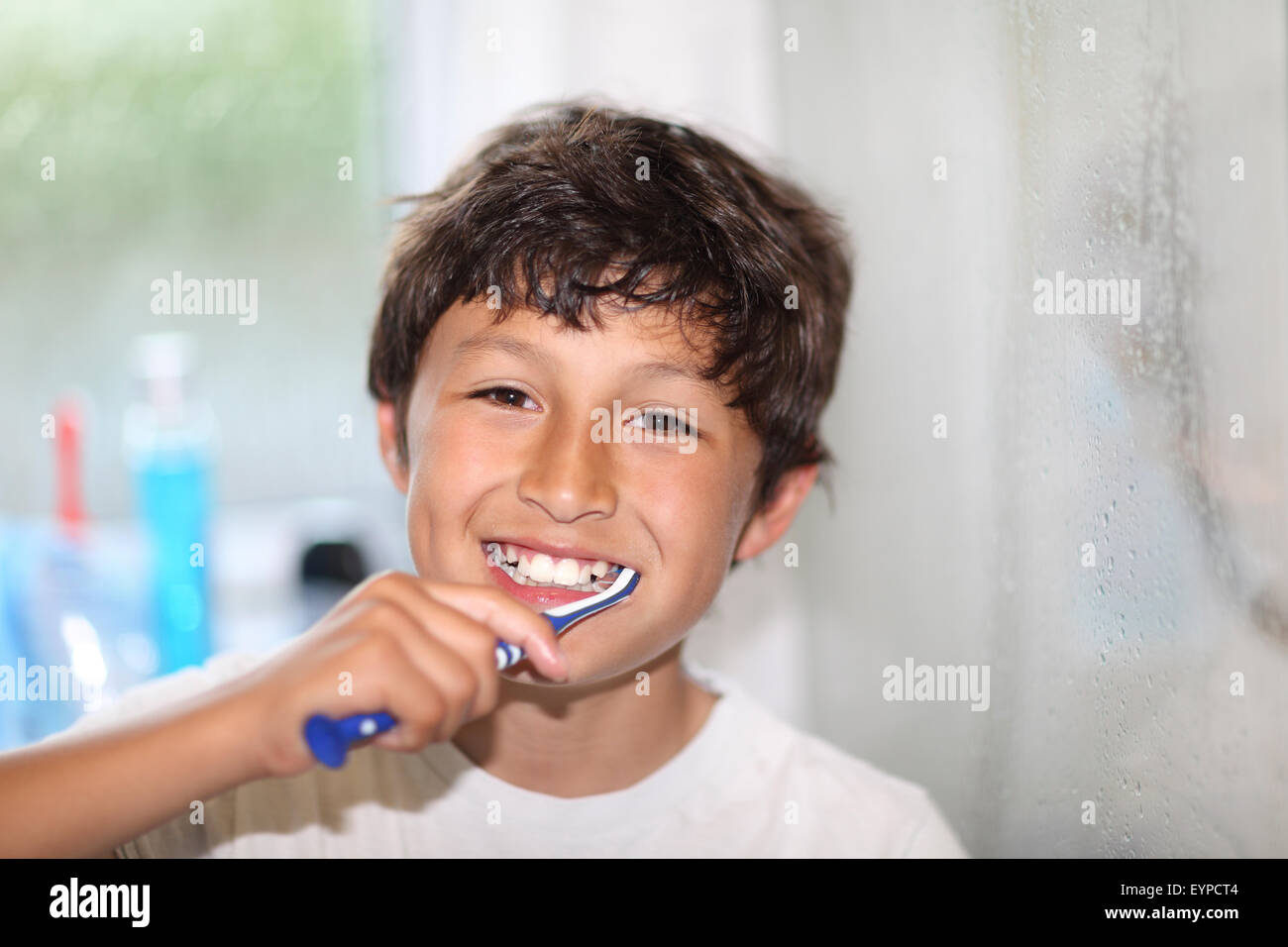 Teen boy brushing teeth hi-res stock photography and images - Alamy