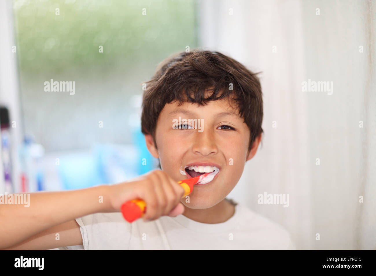 Teen boy brushing teeth hi-res stock photography and images - Alamy