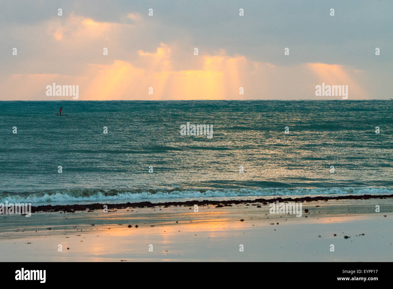 Light reflection on the ocean at sunrise Stock Photo - Alamy