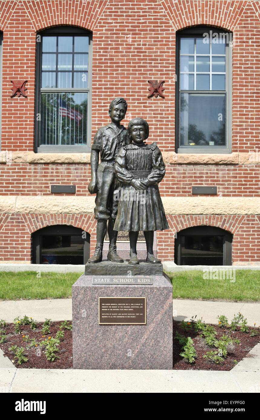 A statue of children in front of the Minnesota State Children's School ...