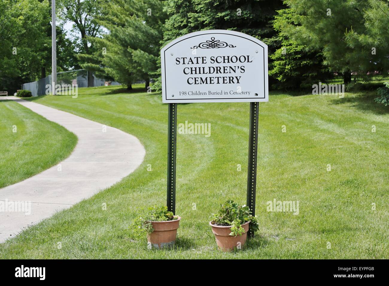 A sign at the State School Children's Cemetery in Owatonna, Minnesota ...