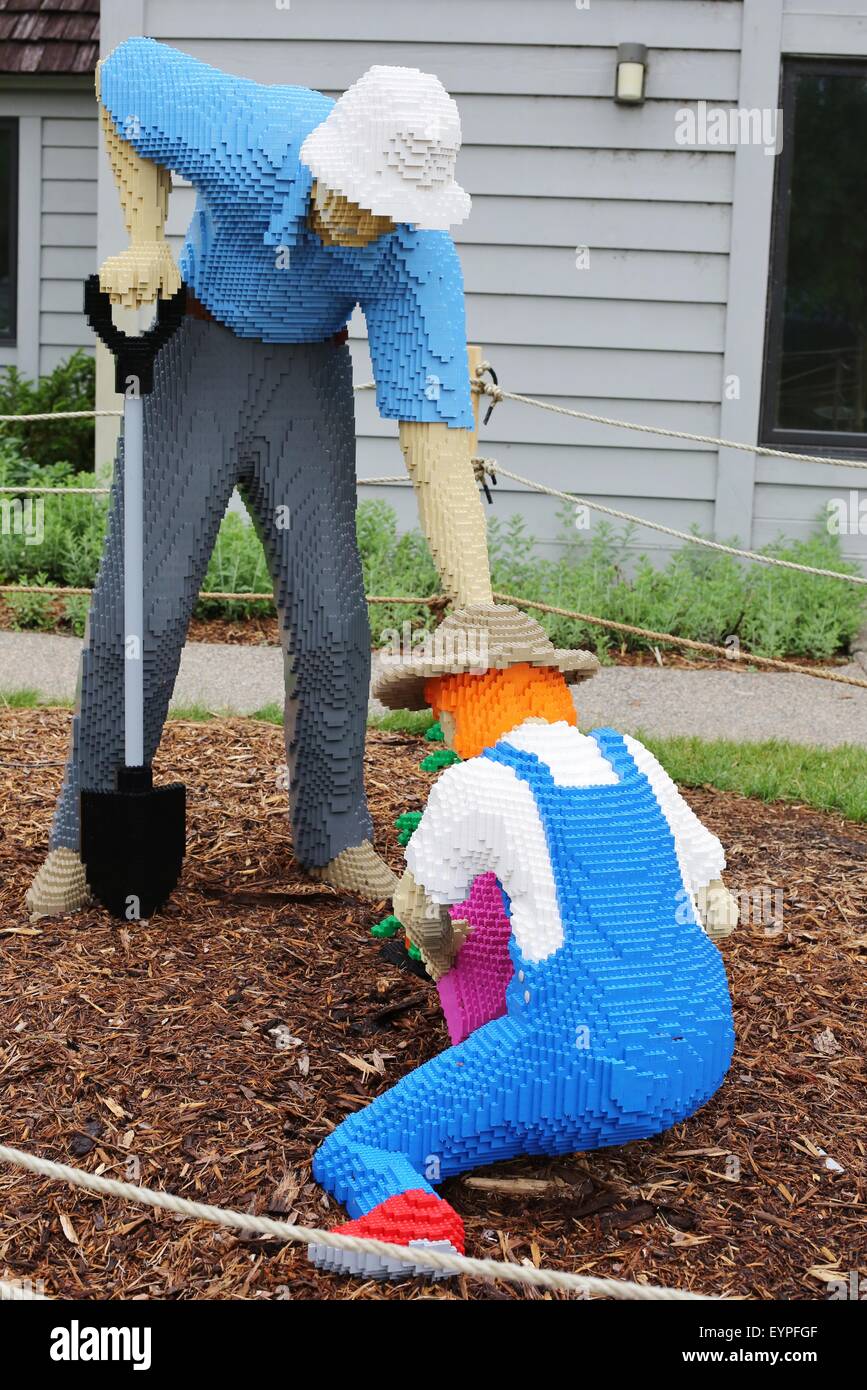 A Lego sculpture of an old man and a child tending a garden by artist ...