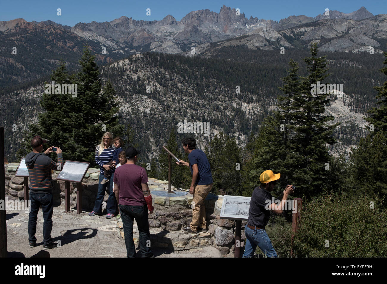 Visitors viewing the Ritter range of Mountains in the Sierra Nevada at ...
