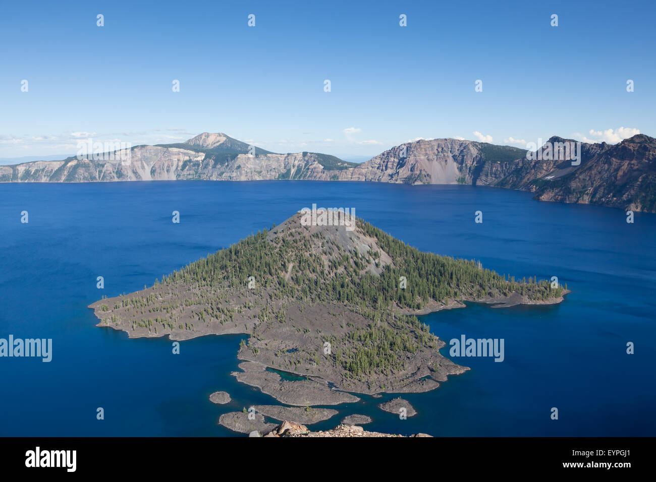Looking down on Wizard Island volcanic cone in the deep blue waters of ...