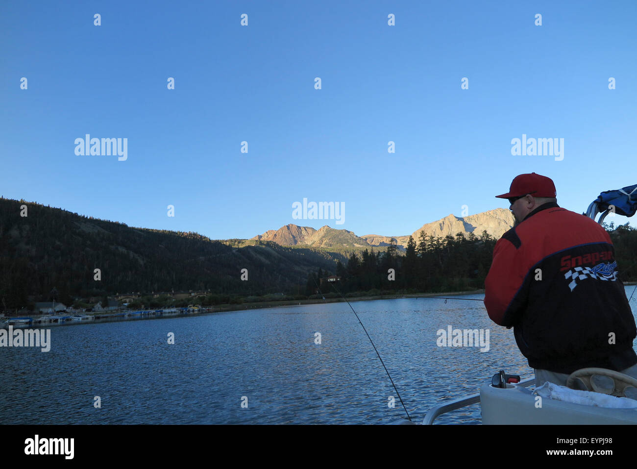 Fishermen on a pontoon boat on June Lake in California in the early ...