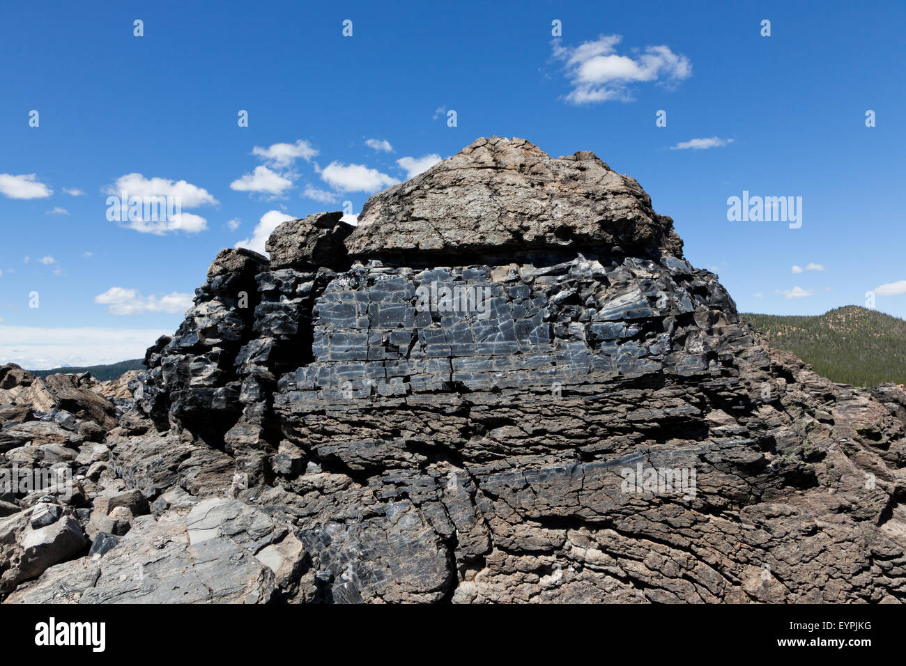 A cross cut section of an obsidian lava flow showing different rock layers at Newberry National ...
