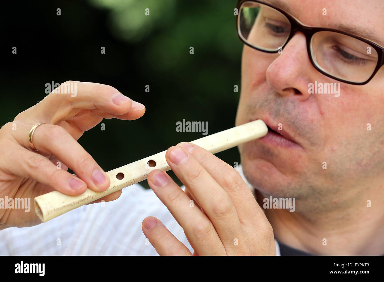 Music archaeologist Adje Both trying to play a replica of a 38,000 year ...