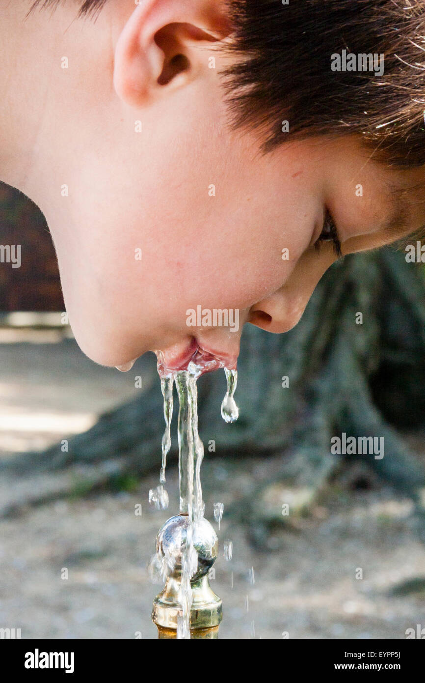 Child, Caucasian boy, 7-8 year old, close up of face. Face facing down ...