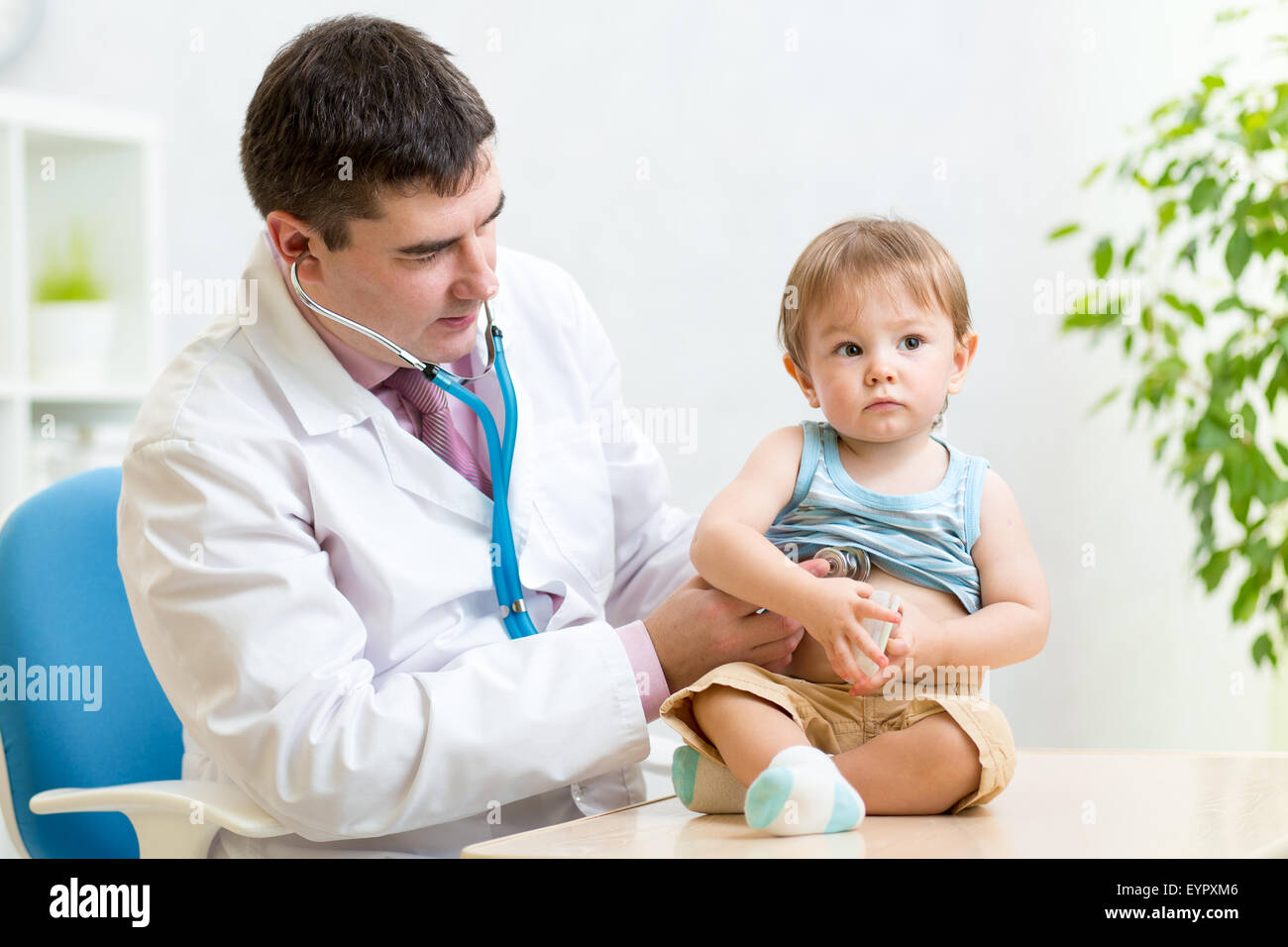 Children's doctor exams infant child with stethoscope Stock Photo - Alamy
