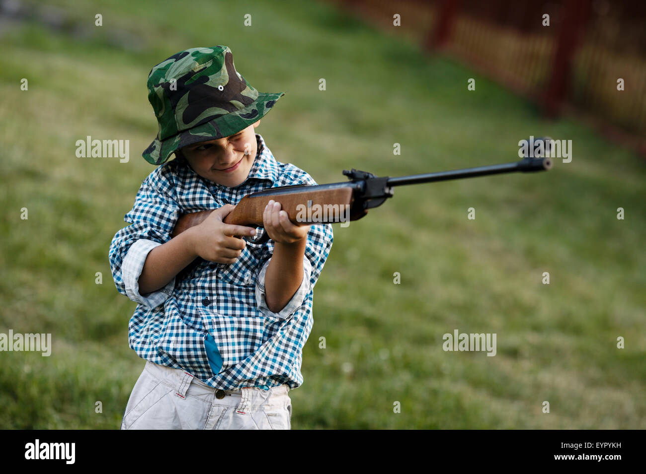 little boy with airgun outdoors Stock Photo - Alamy