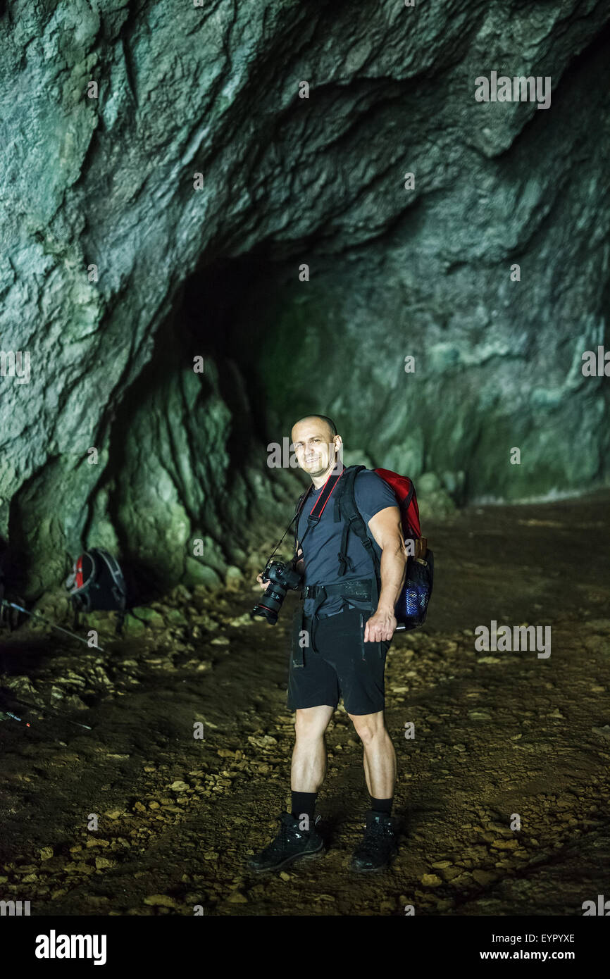 Professional landscape photographer taking shots in a cave Stock Photo ...