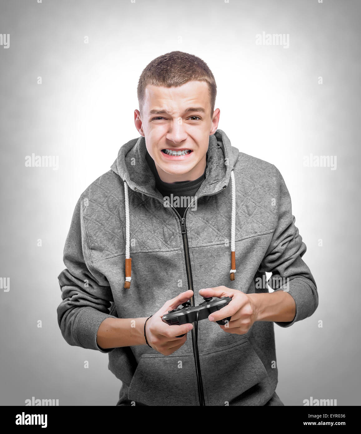 Young man with a joystick Stock Photo - Alamy