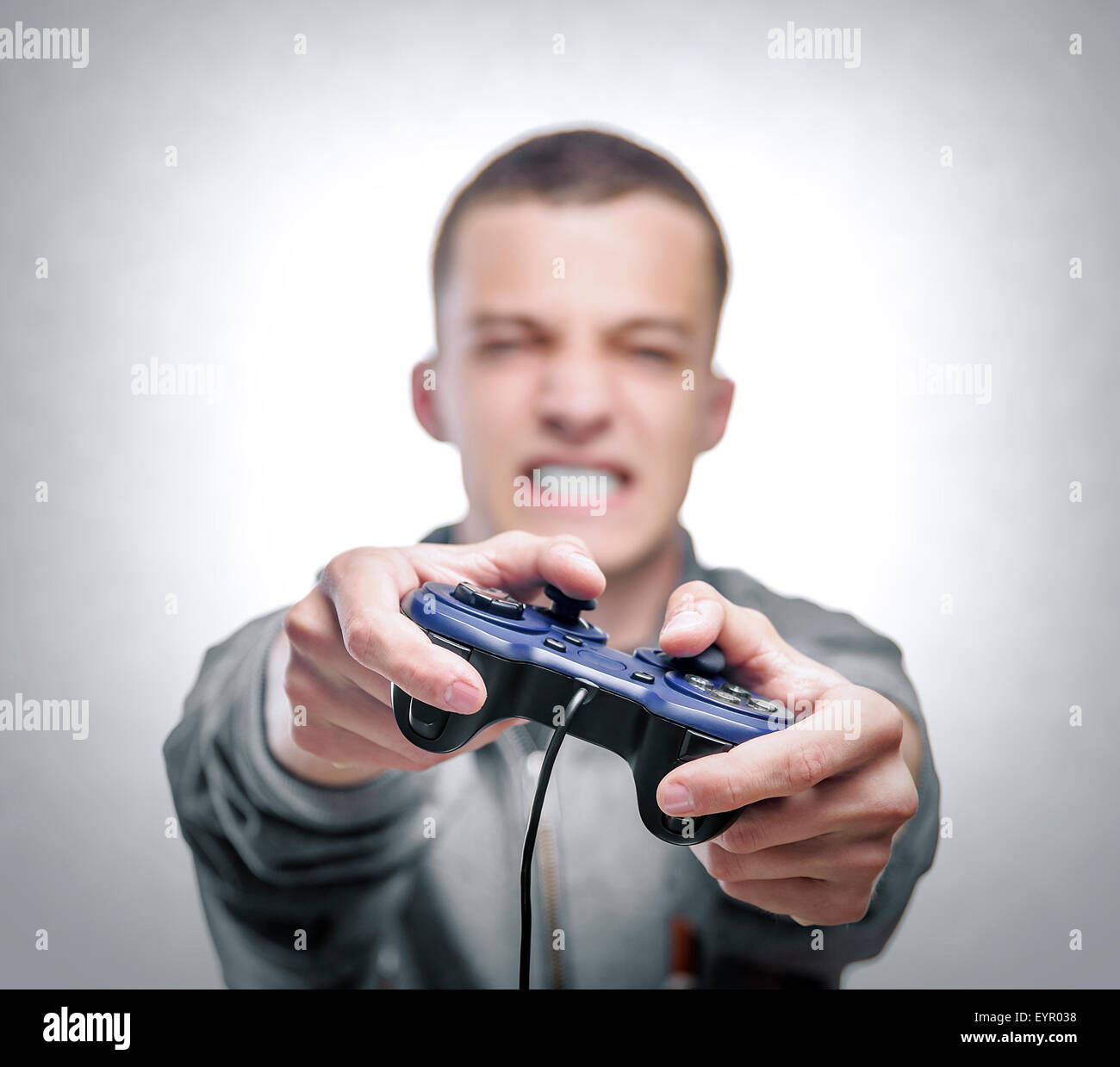 Young man with a joystick Stock Photo - Alamy