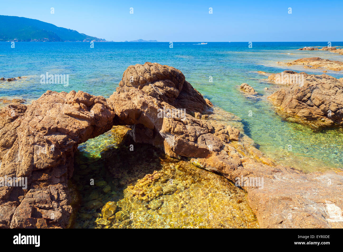 Natural stone grotto on the Mediterranean coast, South Corsica, France ...