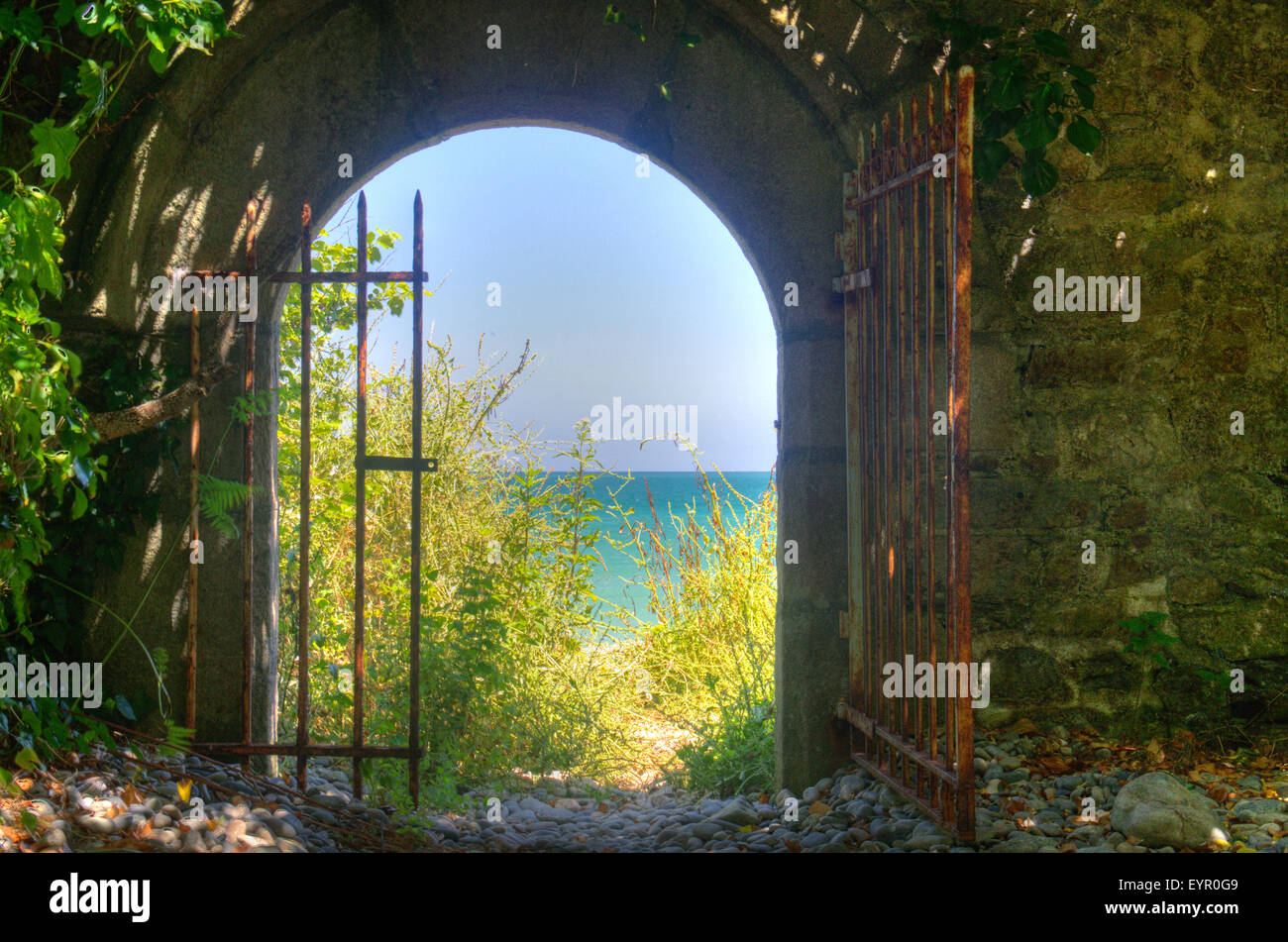 Rusty gate in the old brick wall of an estate near Plage du Palus in ...