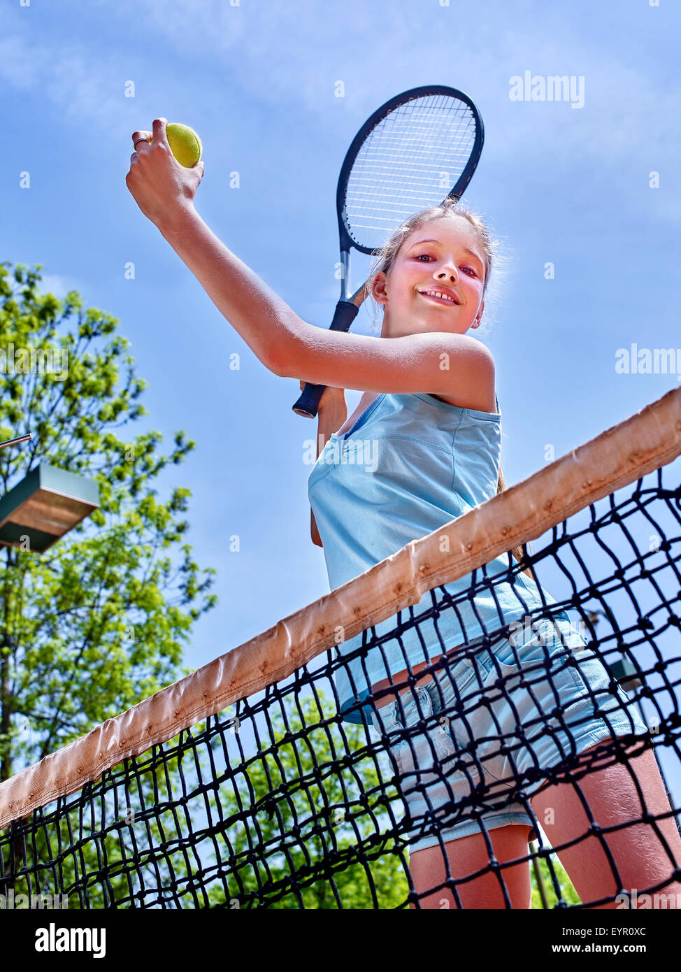Girl athlete with racket and ball on tennis court Stock Photo - Alamy