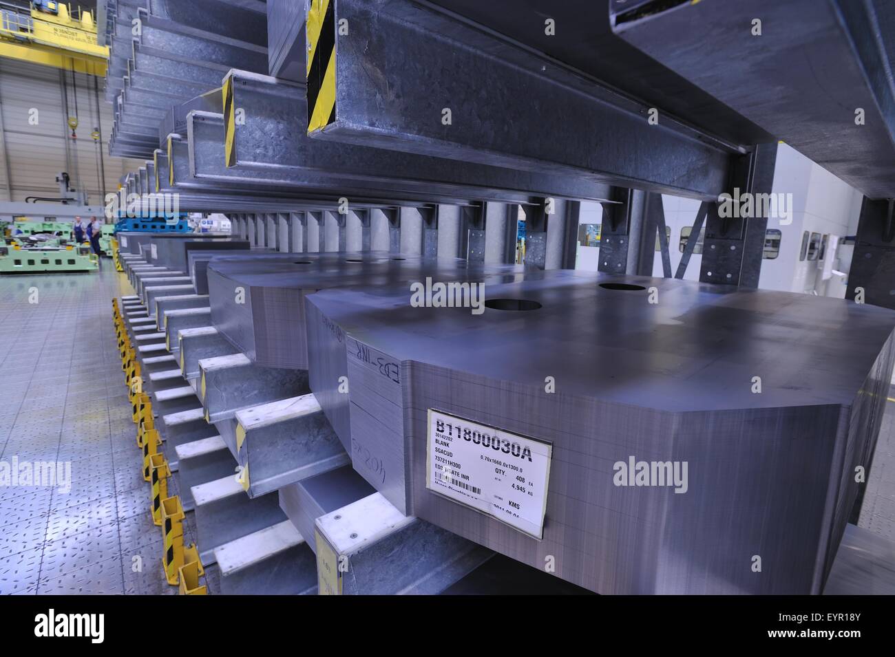 Inside a modern car factory, parts move through the production process ...