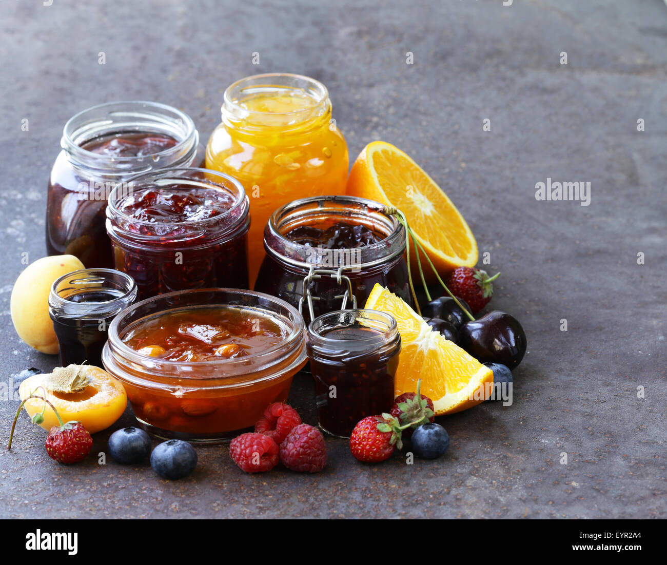 Assorted fruit berry jams (apricot, strawberry, raspberry, orange Stock ...