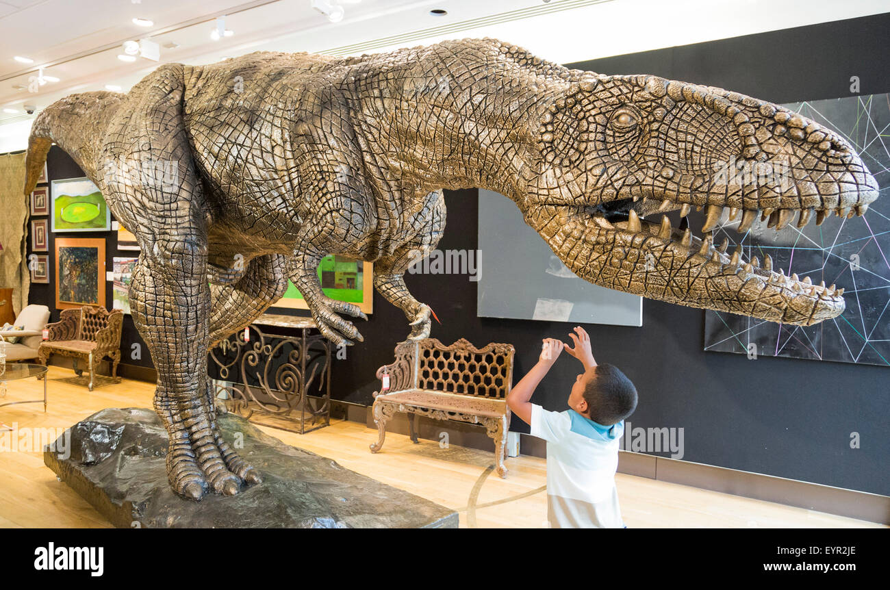 London, UK. 3 August 2015. Joshua, 5, explores a massive bronzed ...