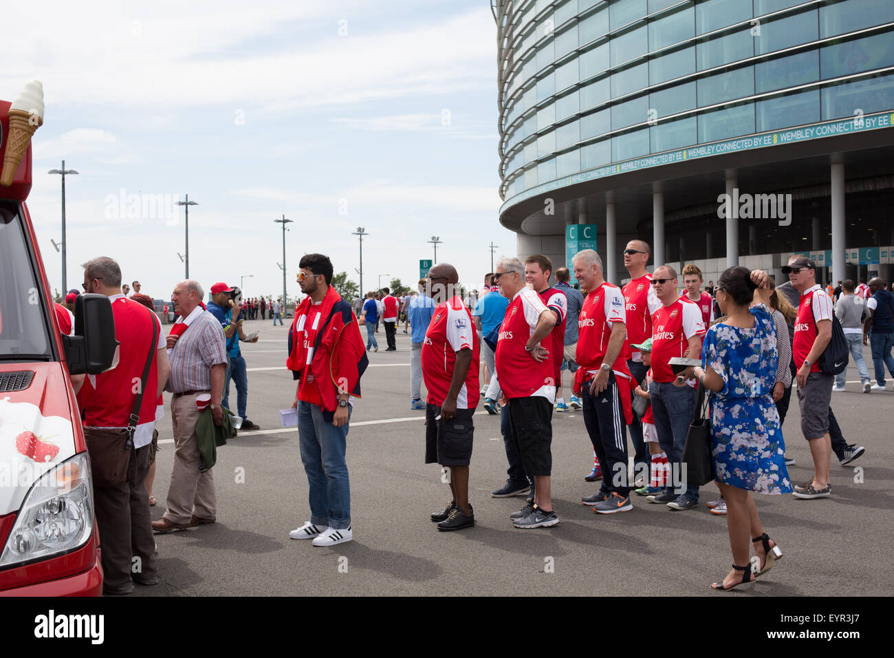 Queuing for lunch in front of an ice cream van outside Wembley Stadium ...
