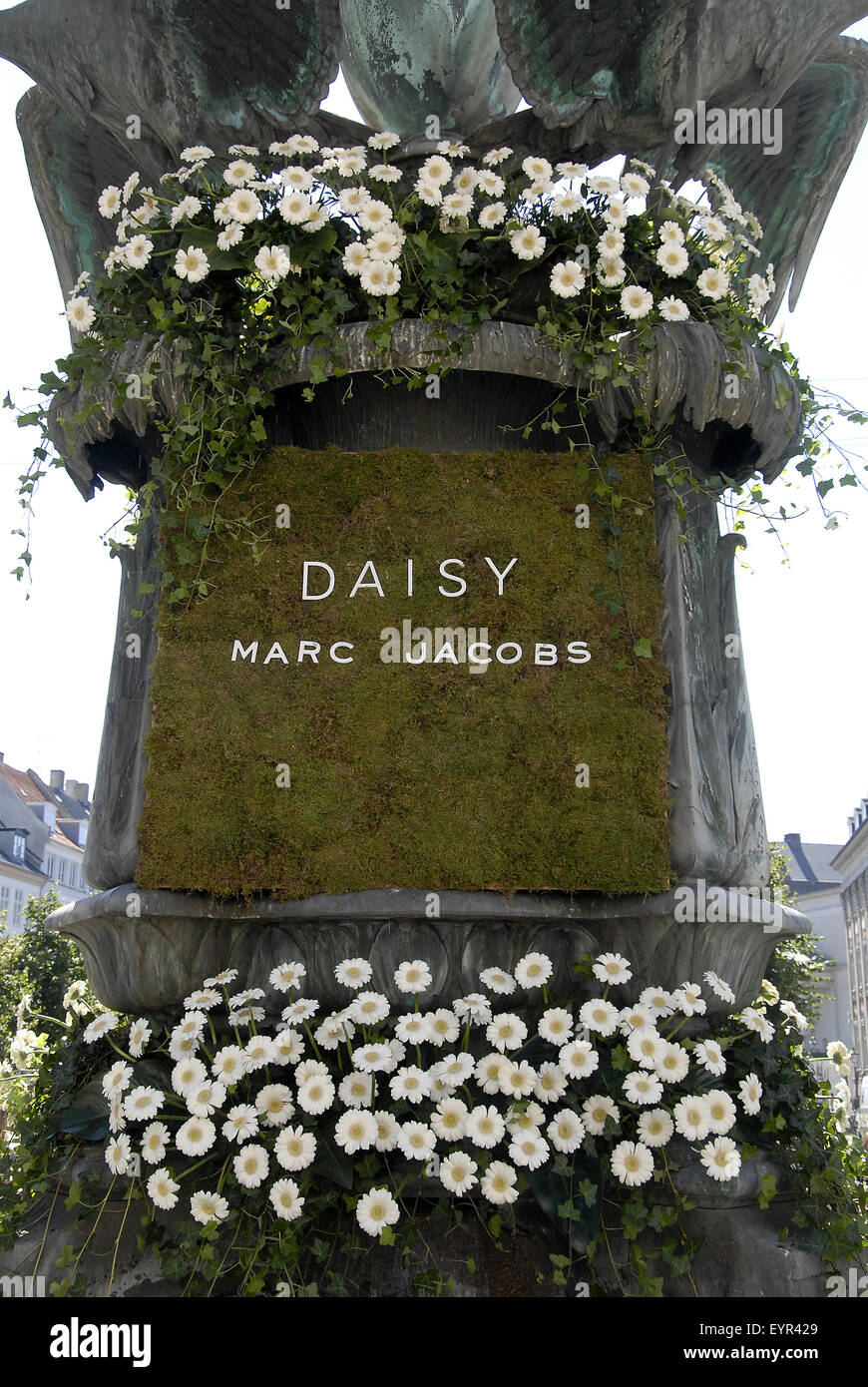 Copenhagen, Denmark. 3rd Aug, 2015. Young blonde female distibute daisy ...
