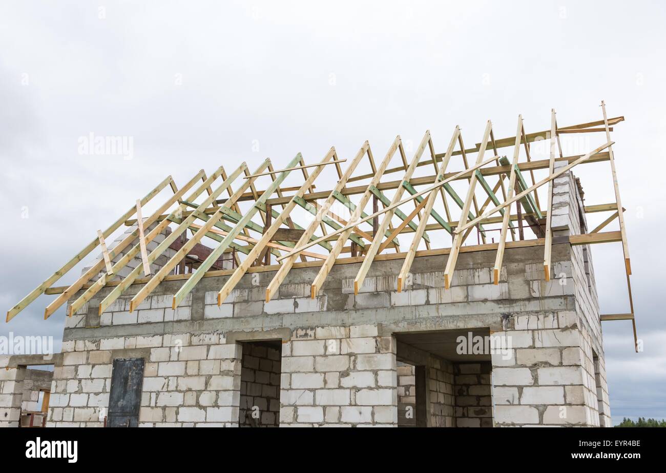 Unfinished house in countryside. Part of house with wooden construction ...