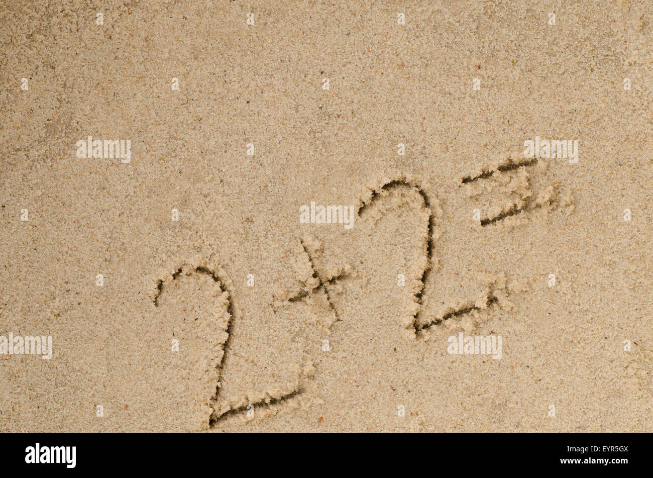 handwritten numbers on sand background Stock Photo - Alamy