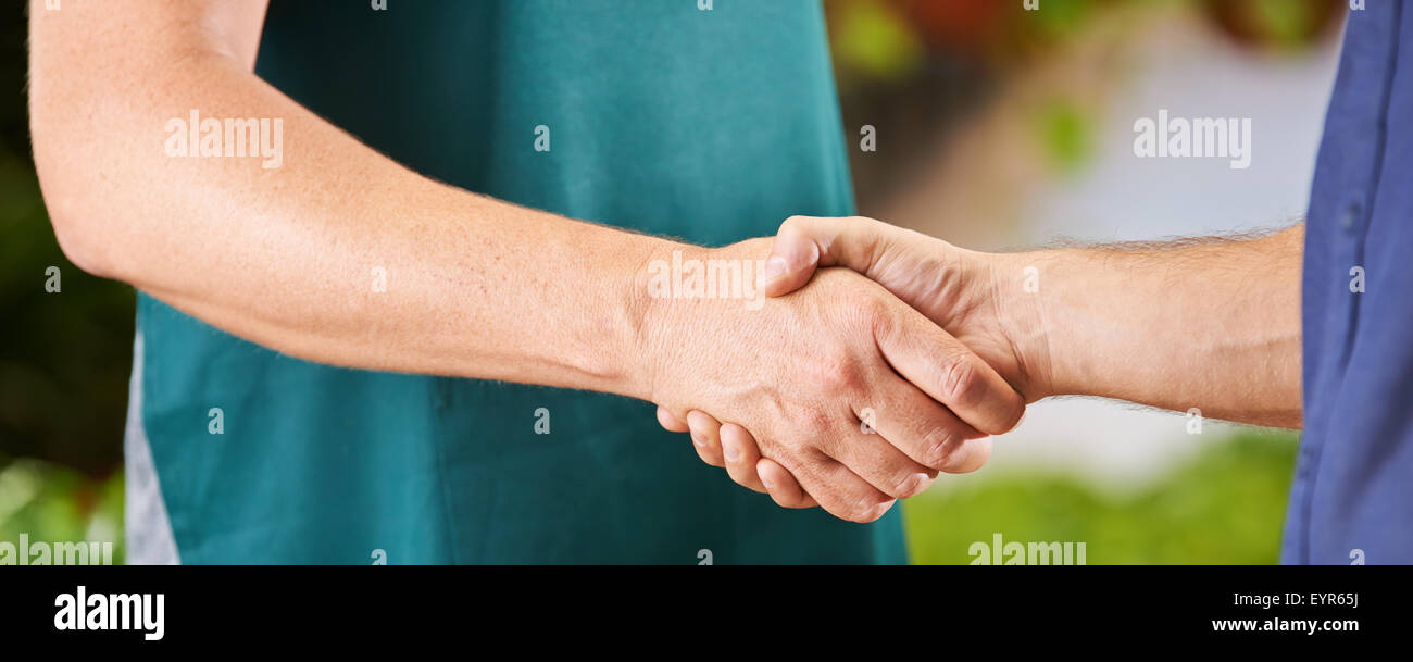 two worker doing welcome shakehands with their hands Stock Photo - Alamy