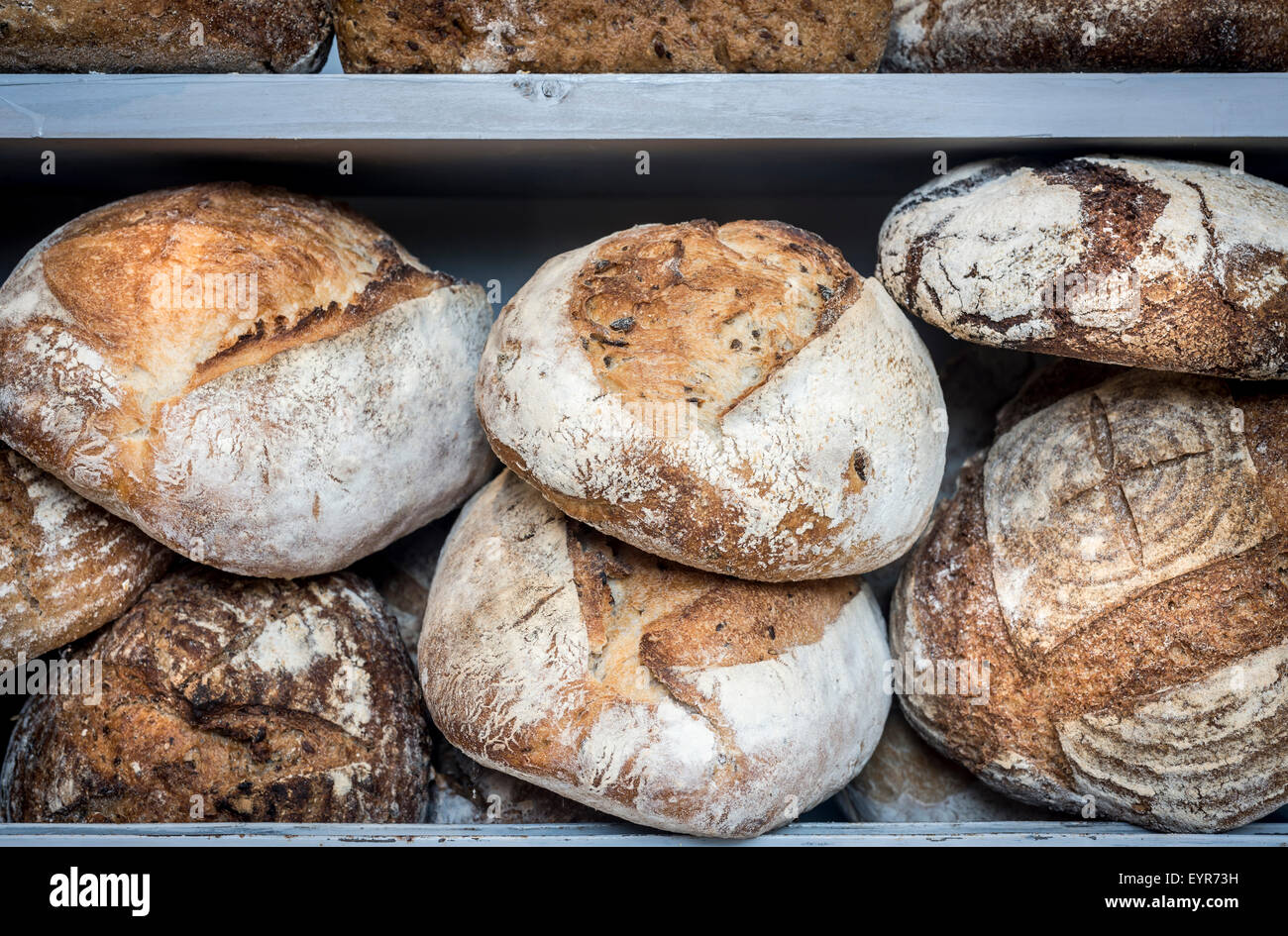 Various traditionally made sourdough breads in a bakery, Devon UK Stock ...