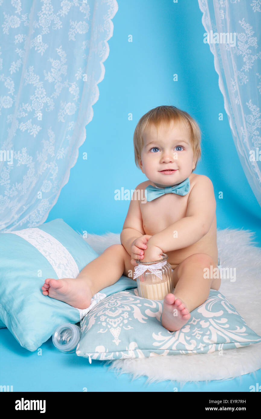 boy plays with pillows studio portrait Stock Photo - Alamy