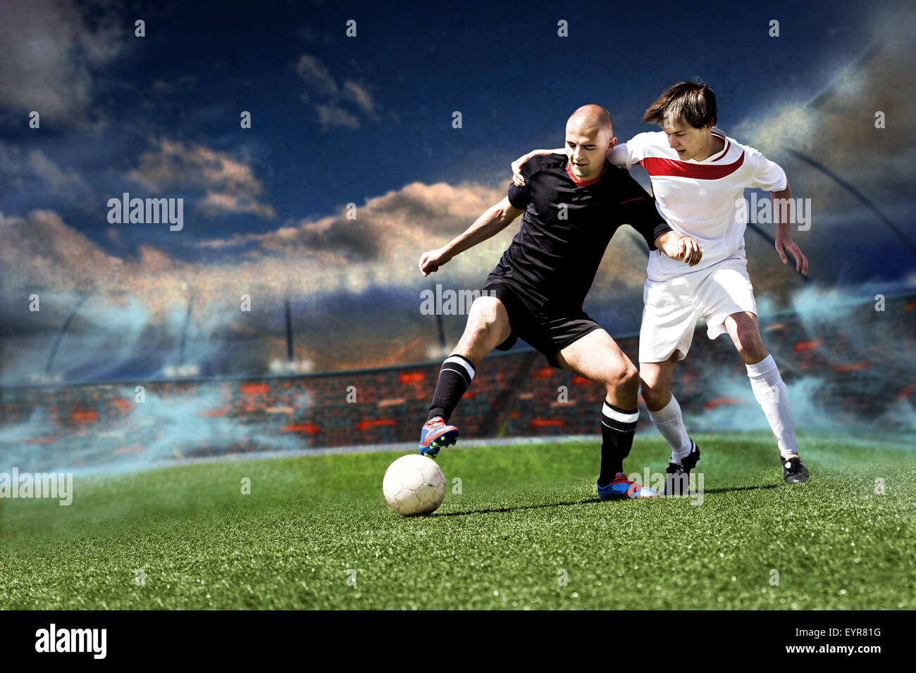two football players from opposing team on the field Stock Photo - Alamy