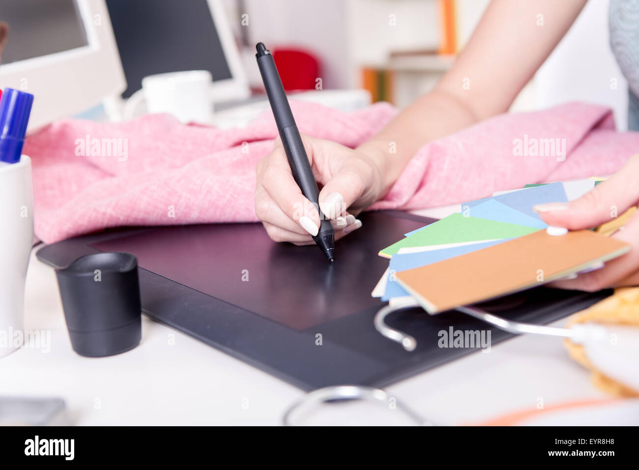 female fashion designer in the office at work Stock Photo - Alamy
