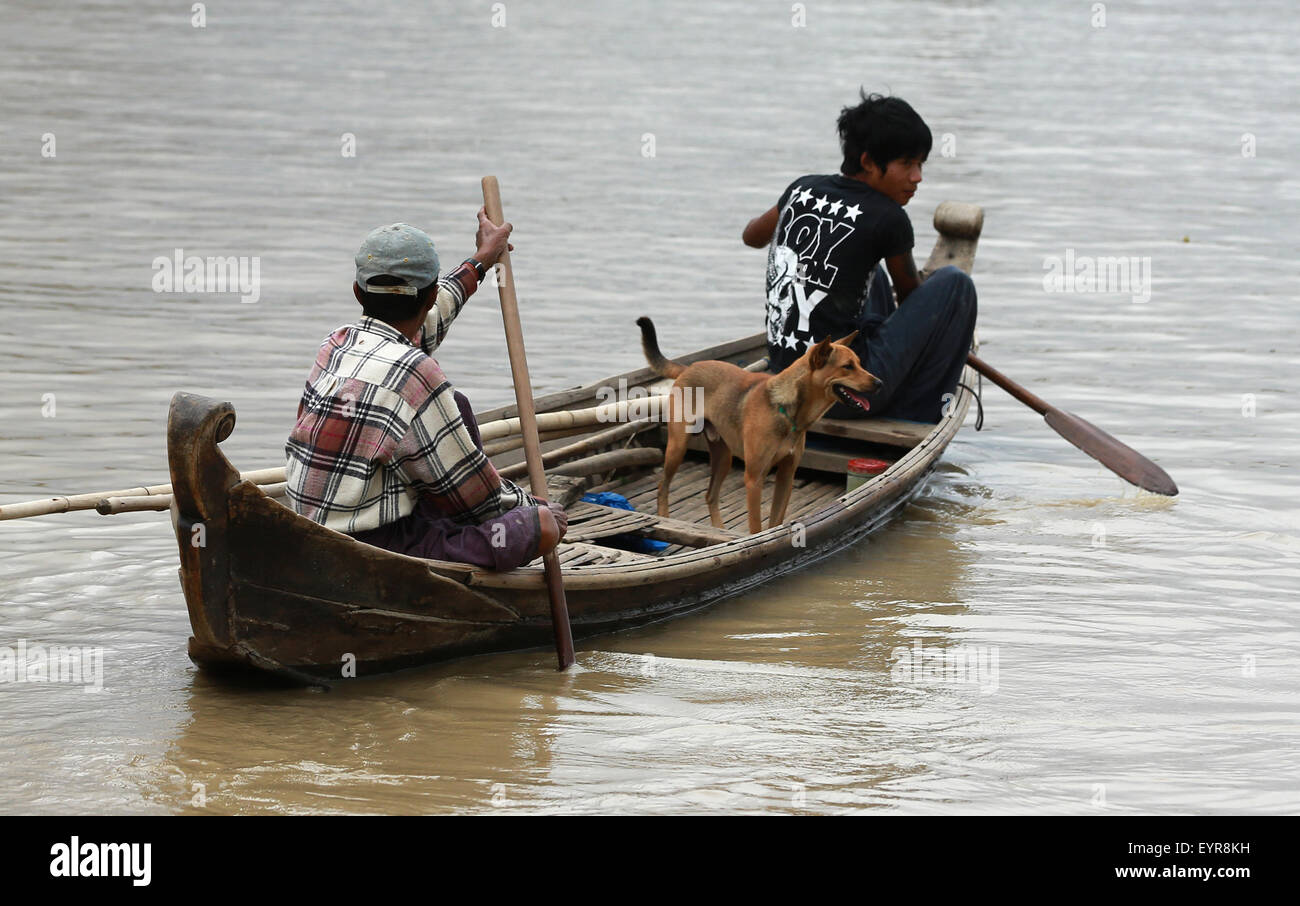 Magway Region, Myanmar. 2nd Aug, 2015. Local residents paddle their ...